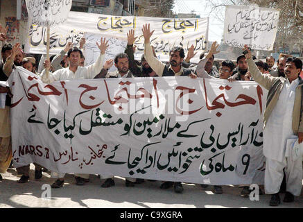 NARS-B Project employees chant slogans in favor of their demands during ...