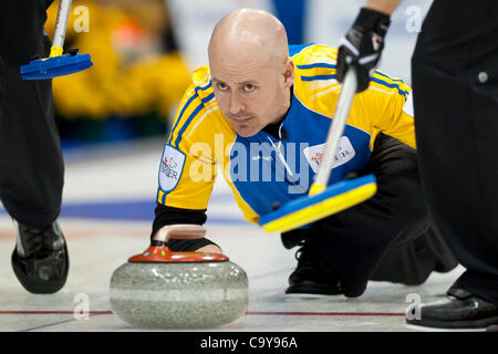 Alberta-Koe skip Kevin Koe delivers a rock while playing Canada during ...