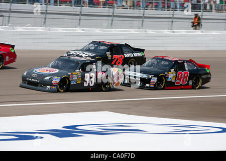 Travis Kvapil, in his #93 Burger King Toyota, hits the wall in the back ...