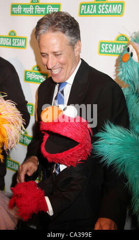 Elmo Jon Stewart with Elmo and Sesame Street Muppets to host Sesame ...