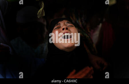 An Kashmiri Muslim women wail during the funeral procession of ruling ...