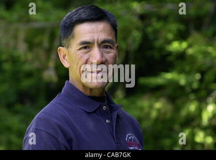 Dr. Ben Ho poses for a photo with his german shepherd, Argus, at his ...