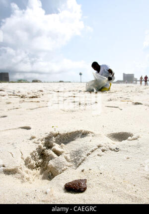 A tar ball on the beach in Grand Isle, Louisiana, the site of the ...