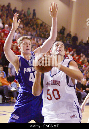 St. Mary's Omar Samhan (50) shoots over San Diego's Gyno Pomare (21 ...