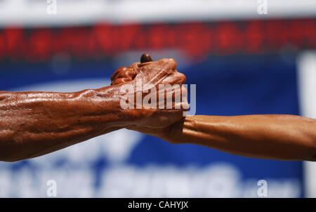 Bill Cunningham 71, and Jane Hesselgesser, 61, pose behind stage during ...