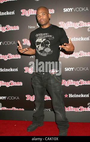 Rapper Darryl McDaniels of Run DMC holds a sneaker from Adidas while ...