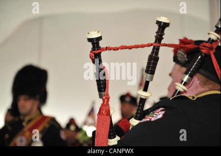 Bagpiper paying bagpipes, from behind, in Boston Gaelic Fire Brigade ...