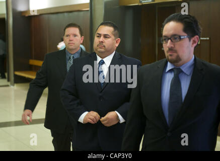 Manuel Ramos and Jay Cicinelli enter the courtroom at the Orange County ...