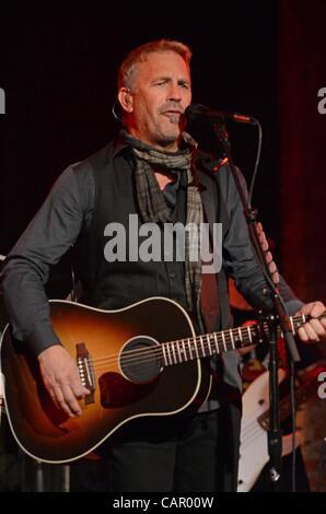 Kevin Costner and Modern West perform in the Nextel FanZone area at ...