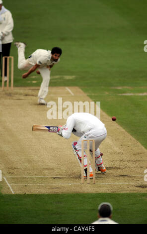 West Indies cricketer Darren Bravo crashes in to the stumps as he is ...
