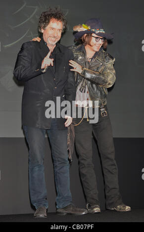 Fans of American director Johnny Depp cheer him on outside a cinema as ...