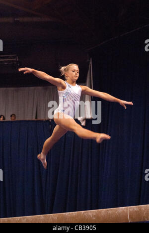 McKenzie Wofford flies high aboe the balance beam practice at the UIC ...