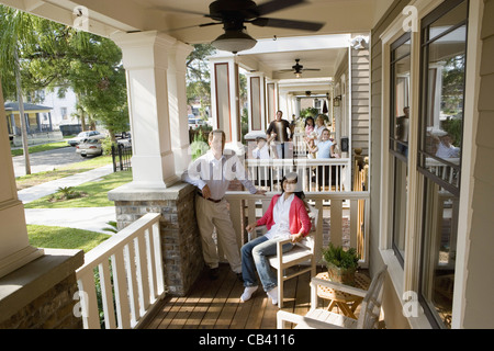 Next-door neighbors on front porches Stock Photo - Alamy