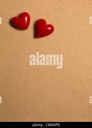 Paper hearts on brown background, close up Stock Photo - Alamy