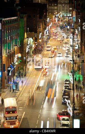 Night shot of a busy, vibrant, energetic Portland Street in Manchester ...