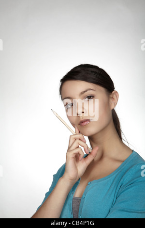 young girl thinking something over Stock Photo - Alamy