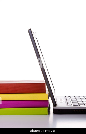 Education and business concept. Next to the books lies a pen and a sign ...