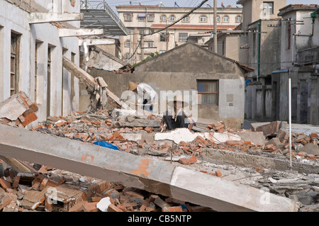 Chinese workers demolish an old buildings abutting on Zhongnanhai ...
