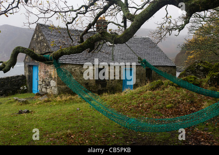 Old pier cottage at Carsaig Bay fishing pier, Isle of Mull, Scotland ...