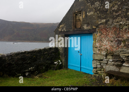 Old pier cottage at Carsaig Bay fishing pier, Isle of Mull, Scotland ...