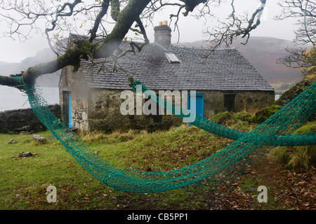 Old pier cottage at Carsaig Bay fishing pier, Isle of Mull, Scotland ...