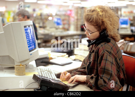 Attractive female librarian at work Stock Photo - Alamy
