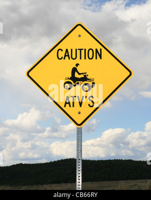 Bright yellow caution sign warning of an uneven surface on a wooden ...