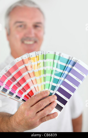 Color paint chips of green shades on light background, top view Stock ...