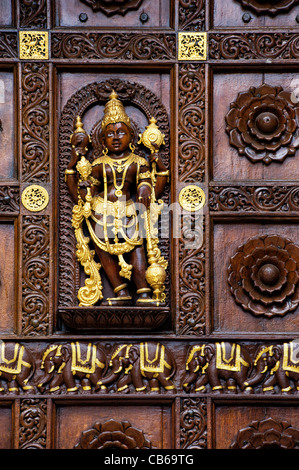Sathya Sai baba ashram, decorated carved wooden gopuram gates ...