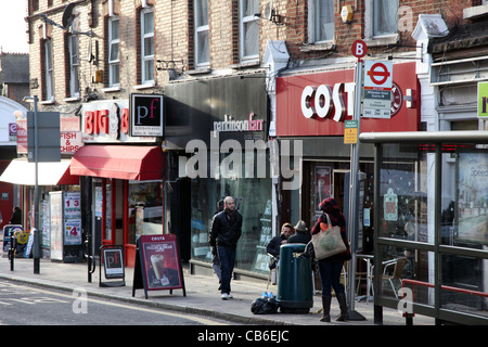 Willesden Green shops and bus stop outside the Underground Station ...