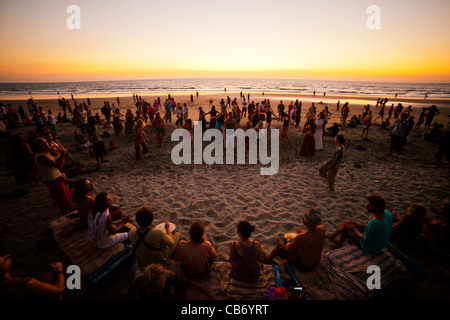 goa shore sunset dance drum sea motion merriment Stock Photo - Alamy