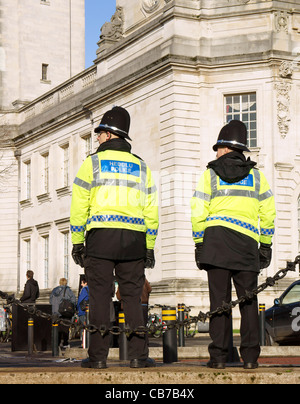 Two Welsh Heddlu or police officers, dressed in riot gear on the ...