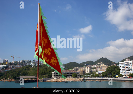yellow triangular taoist flag flying outside shui sin temple stanley ...