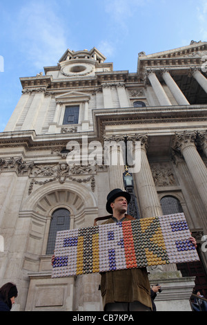 A protester holds placard in support of minority rights alongside ...