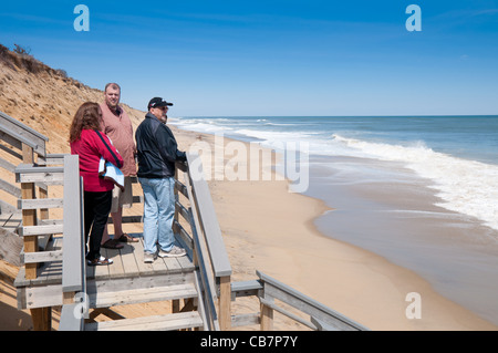 People watching the ocean at stairs of Marconi Beach, Cape Cod ...