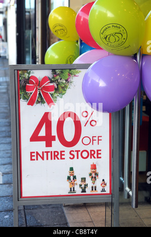 Discount sign in shop window Stock Photo - Alamy