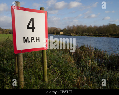 A 4MPH speed limit sign on the bank of a river Stock Photo - Alamy