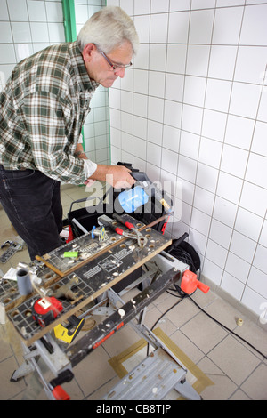 Plumber using a blow torch Stock Photo - Alamy