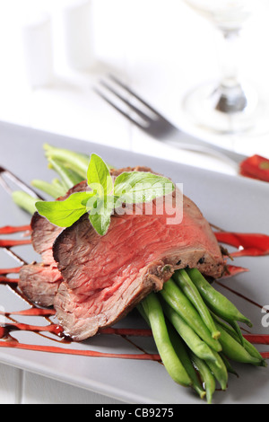 Slices of roast beef and string beans Stock Photo - Alamy