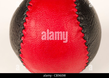 Traditional handmade Spanish pelota ball, with its typical coarse seams ...