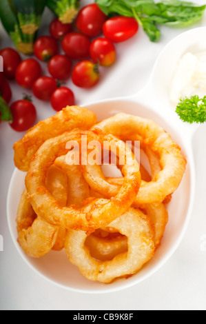 Golden fried breaded onion rings snack Stock Photo - Alamy