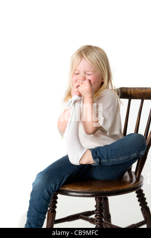 Laughing girl pulling off sock of a boy, they are preparing for a ...