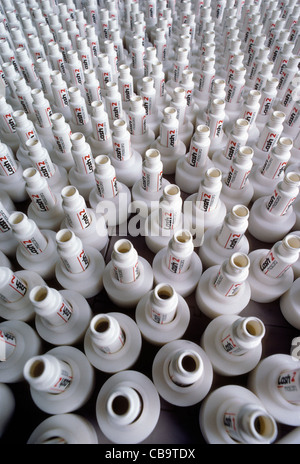 Containers of cosmetics on the assembly line Stock Photo - Alamy