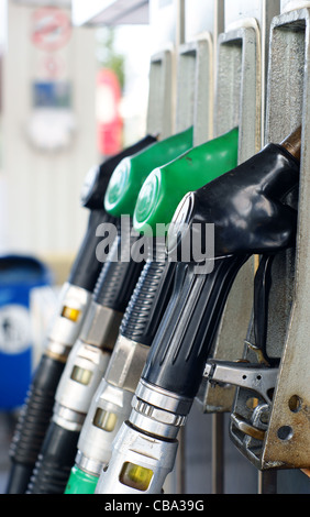 Gas nozzles at a gas station. Rising oil prices Stock Photo - Alamy