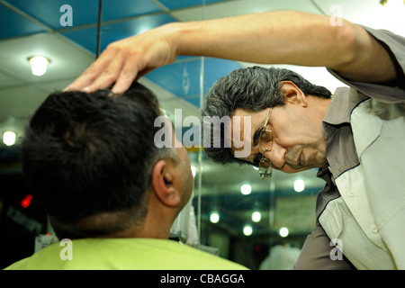 Prince barber shop in the Karrada area of Baghdad, Iraq. Two of the ...