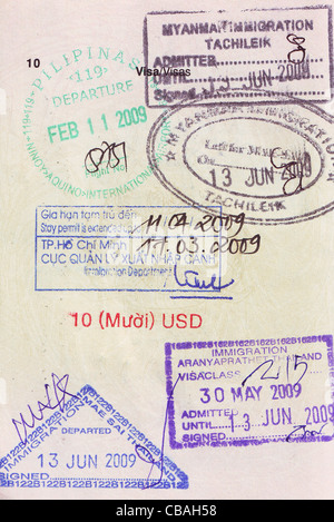 Entry and exit visa stamps of Thailand on a page in a passport Stock ...