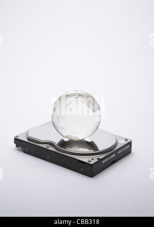 Glass globe on hard disk Stock Photo - Alamy