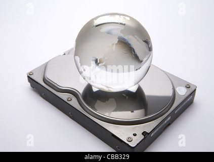 Glass globe on hard disk Stock Photo - Alamy