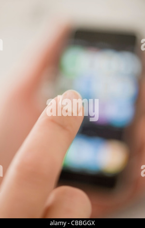 Close up of female finger answering phone call in front of train on ...