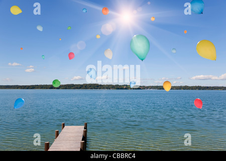 Balloons Floating over Lake Stock Photo - Alamy